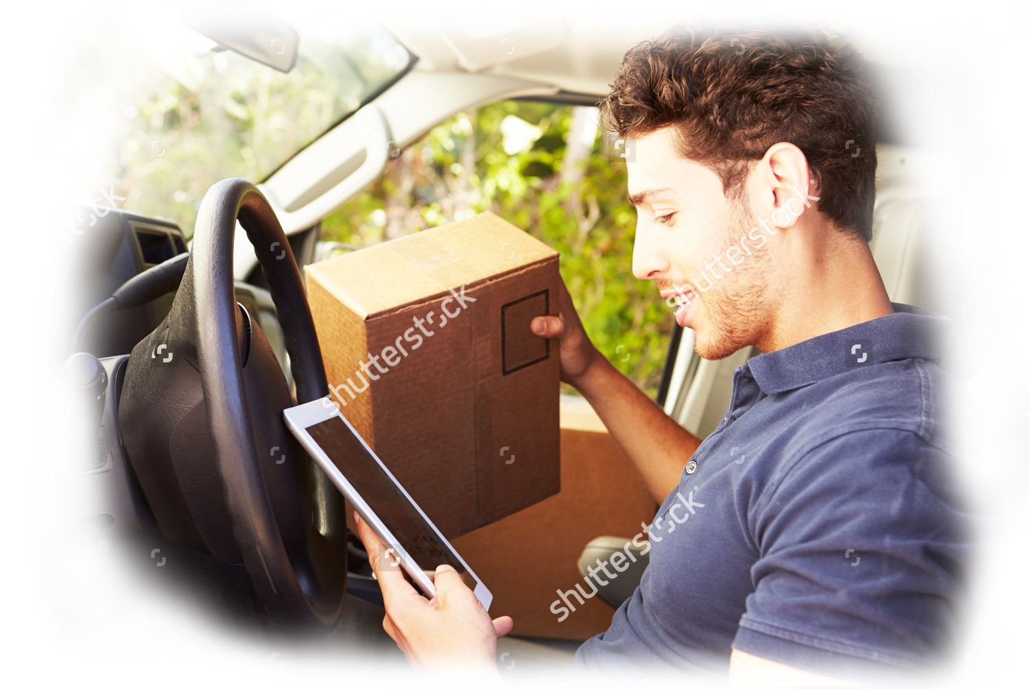 stock-photo-delivery-driver-sitting-in-2van-using-digital-tablet ...