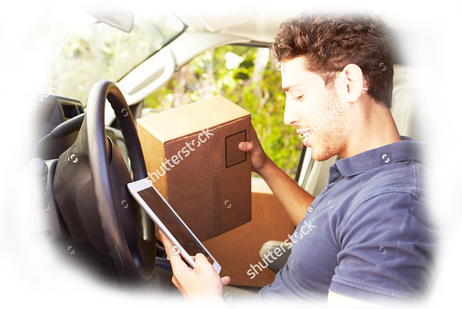 stock-photo-delivery-driver-sitting-in-van-using-digital-tablet ...